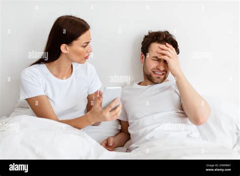 Jealous Wife Showing Cheating Husband His Phone Demanding Explanation