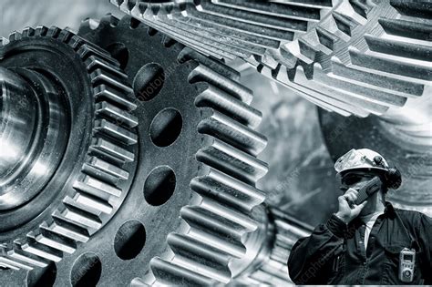 Engineer With Gears And Cogs Stock Image F017 1966 Science Photo Library