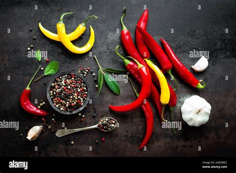 Red Hot Chili Pepeprs And Peppercorns On Black Metal Background Top