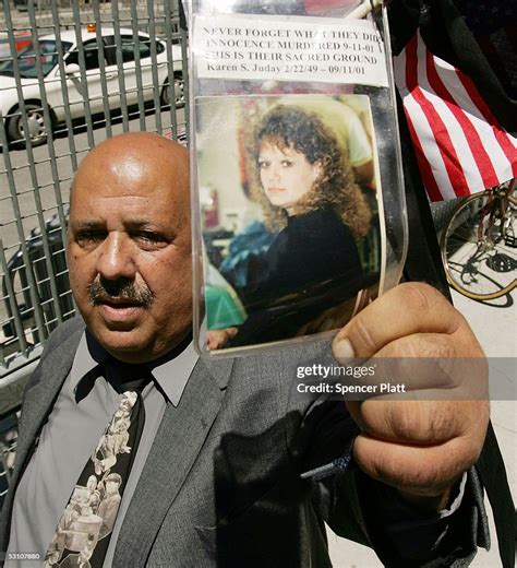 Richard Pecorella Holds Up A Picture Of His Fiance Karen Juday Who