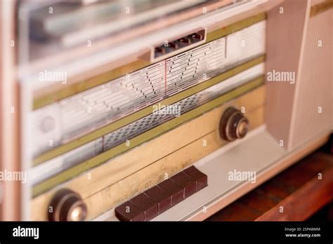 Close Up Of A Vintage Radio With A Horizontal Tuning Scale Displaying Various Frequency Numbers