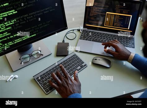 Top View Closeup Of Unrecognizable Software Developer Writing Code At Workplace In Office With