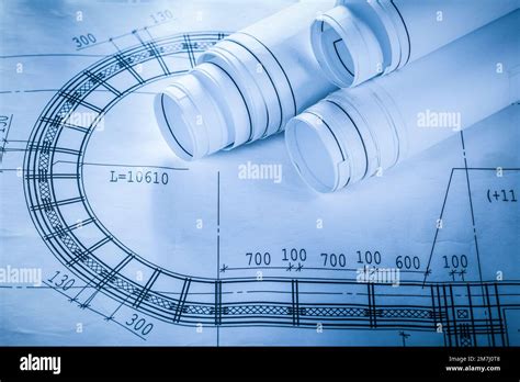 Rolled Construction Drawings On Blueprint Stock Photo Alamy