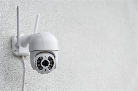 Premium Photo Round Cctv Camera With Antennas Shoots Video On The White Wall