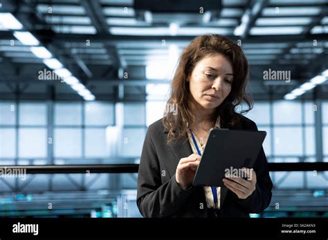 Technician In Data Center Using Tablet Conducting Security Audits