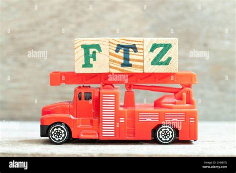 Fire Ladder Truck Hold Letter Block In Word Ftz Abbreviation Of Free Trade Zone On Wood
