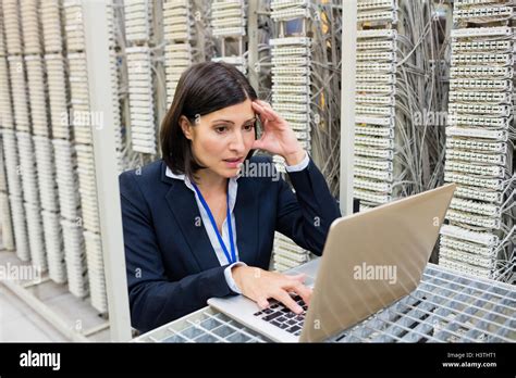 Technician Using Laptop Stock Photo Alamy