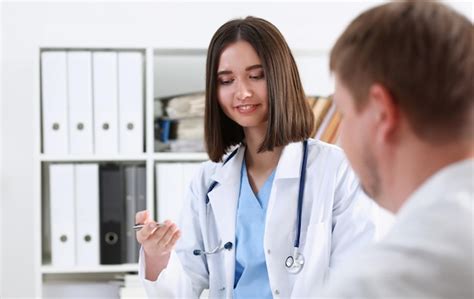 Premium Photo Beautiful Smiling Female Doctor Hold