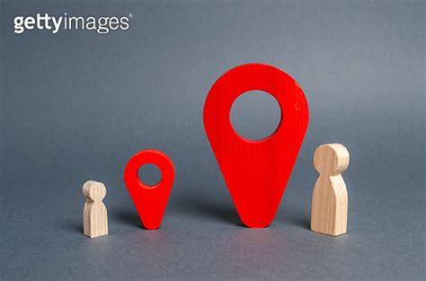 Small And Big Man Near The Red Location Pointers The Meeting Place Of