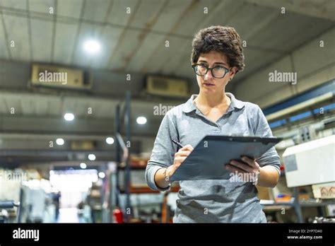 Caucasian Adult Woman Checking Quality Of Products In A Cnc Metallurgic Factory Stock Photo Alamy
