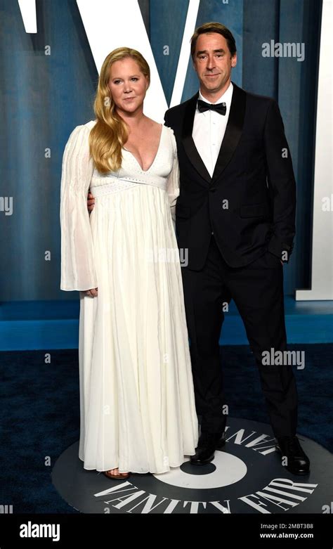 Amy Schumer Left And Chris Fischer Arrive At The Vanity Fair Oscar Party On Sunday March 27