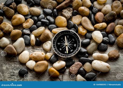 Sea Journey Travelling And Vacation Concept Compass On Rocks And Grey