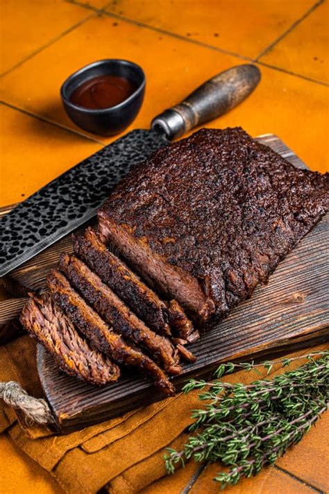 Smoked Barbecue Beef Brisket With Sauce On Wooden Board Orange