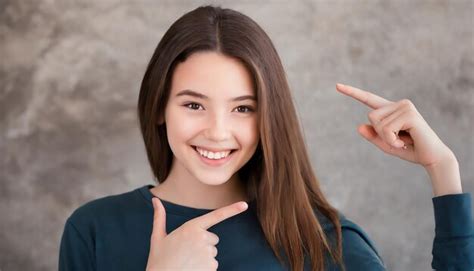 Premium Photo Closeup Portrait Of A Smiling Girl Pointing Her Index