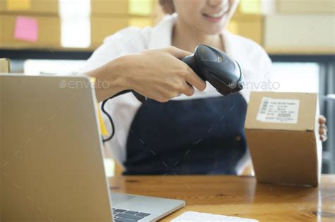 Babe Asian Businesswoman Use Bar Code Scanner Scan The Barcode On The Product Box Stock Photo