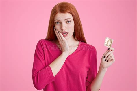 Safe Sex Concept Attractive Young Female With Red Long Hair And Stock