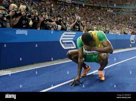 Jamaicas Usain Bolt Celebrates Setting A New World Record As He Wins