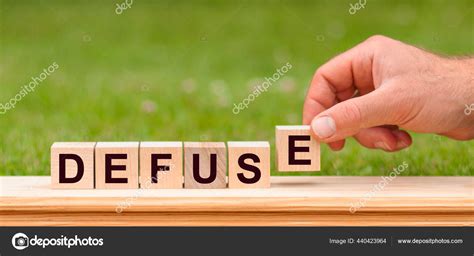 Word Defuse Written Wooden Blocks Man Hand Holding Wooden Cube Stock