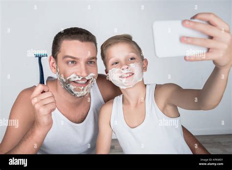 Father And Son Shaving Together Stock Photo Alamy