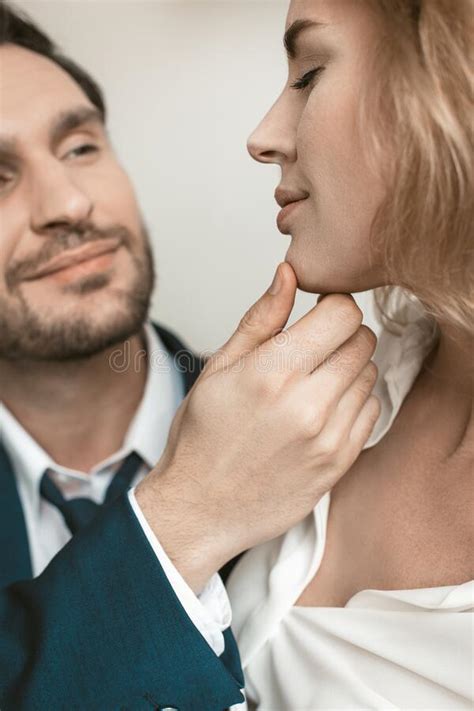 Passionate Couple In The Office At The Workplace Man Holds A Girl By