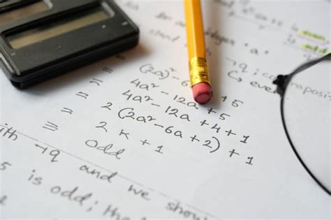 Premium Photo Hand Writing Algebra Equations On A Paper