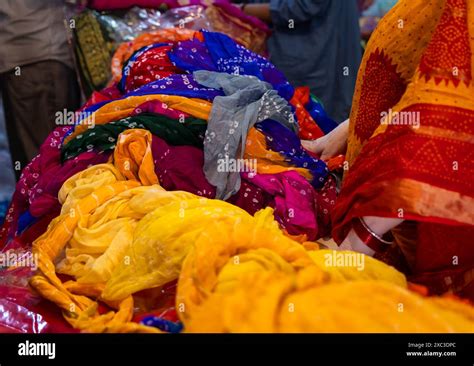 Retails Clothe Seller Showing Different Kind Of Indian Traditional