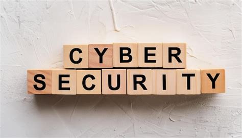wood blocks with text cyber security protecting systems networks