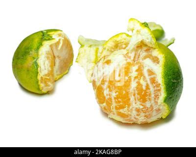 Unripe Tangerine Peeling A Tangerine Green Fruit On A White