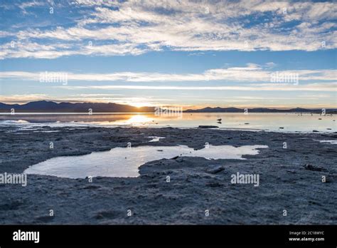 Nice Landscape In A Frozen Lake With A Blue Sky And The Sun Rising In