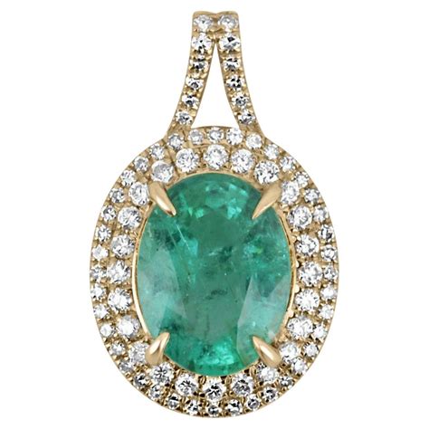 475 Carat Trillion Cut Emerald And Diamond Double Halo Pendant
