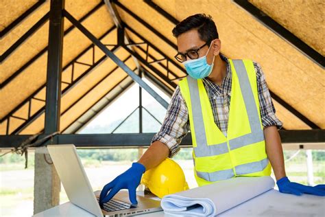 Construction Worker Wearing Protective Mask At Construction Site Stock Photo At Vecteezy