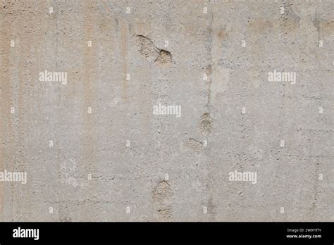 Flat Gray Solid Concrete Wall With Shoe Soles Imprints Full Frame