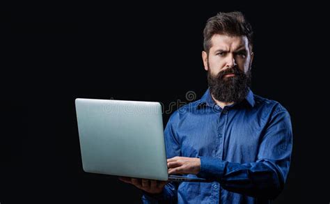 Serious Handsome Bearded Man Worker Laptop Bearded Male Businessman Holding A Computer In His