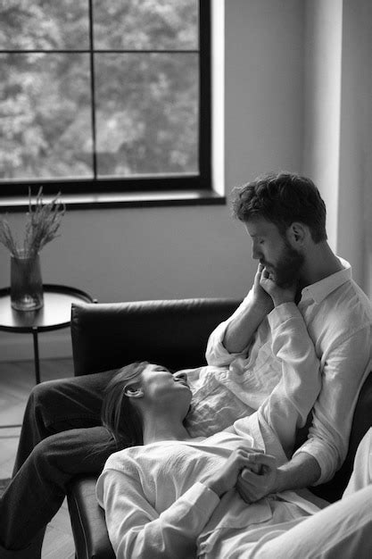 Free Photo Couple Sitting On Couch High Angle