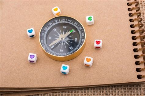 Premium Photo Heart Cubes Around A Compass