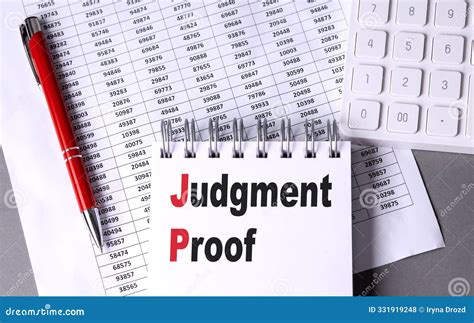 Judgment Proof Text On Notebook With Chart Pen And Calculator Stock