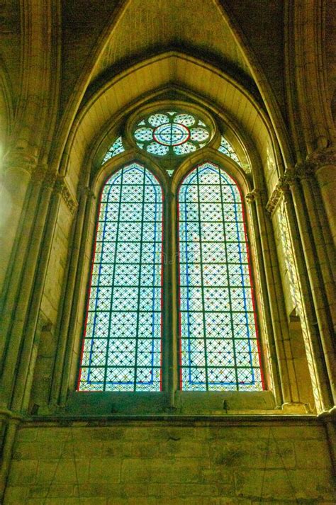 Interior View Of A Pair Of Tall Stained Glass Window Receiving