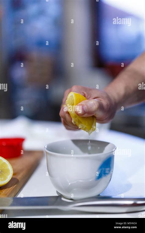 man hands squeeze citrus Stock Photo - Alamy