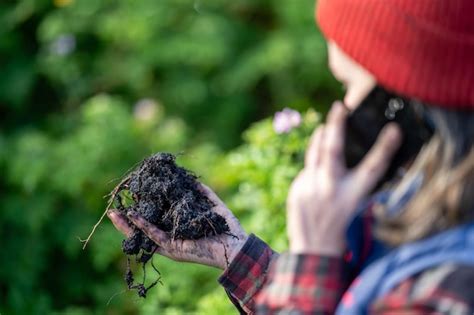 Premium Photo Female Farmer Using Technology To Test Soil Farmer Taking A Photo Of A Soil