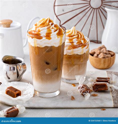 Iced Caramel Latte Topped With Whipped Cream And Caramel Sauce Stock
