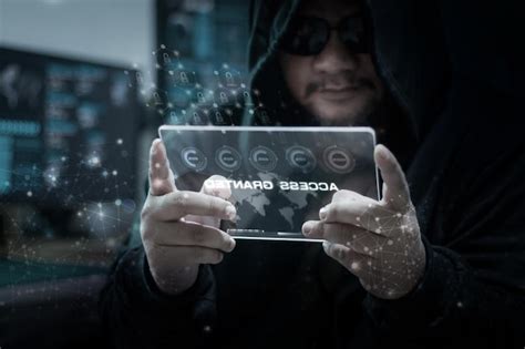 Premium Photo Computer Hacker Using Glass Tablet Seen Through Interface