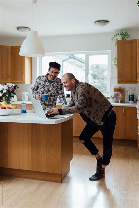Male Gay Couple Dhaving Breakfast And Using Laptop By Stocksy