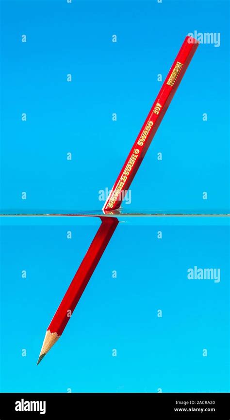 Light Refraction Experiment Pencil In Water Being Used To Demonstrate The Effects Of The