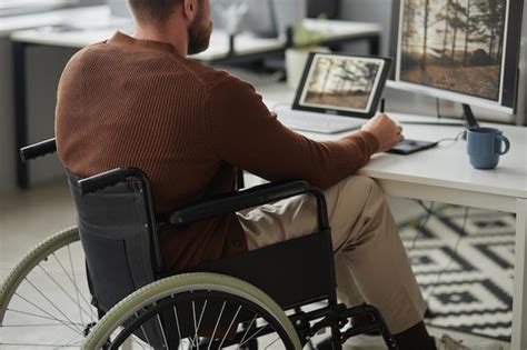 Premium Photo Close Up Of Man With Disability Working As Photo Editor