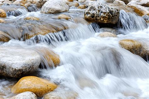 Flowing Freshwater Stream Cascading Over River Rocks 75671113 Stock