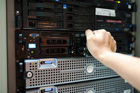 Technician Repairing Network Server In The Data Center Facility Photo
