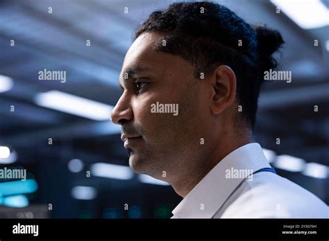 it specialist walking through operational server rows in computer