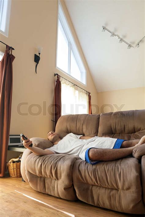 Lazy Man Laying On The Sofa Stock Image Colourbox