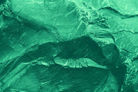 빈티지 녹색 배경입니다 에메랄드 색상의 거친 페인트 벽 Virid 색깔의 불완전 한 비행기입니다 고르지 못한 오래 된 장식 톤의