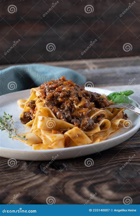 Ragout With Pasta On A Plate On Wooden Background Stock Image Image Of Delicious Cooking